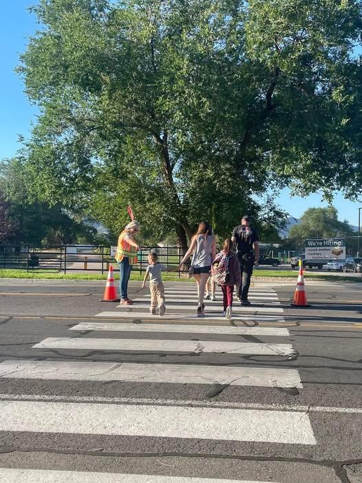 A crosswalk that has a pattern of wide striped lines running from curb ...