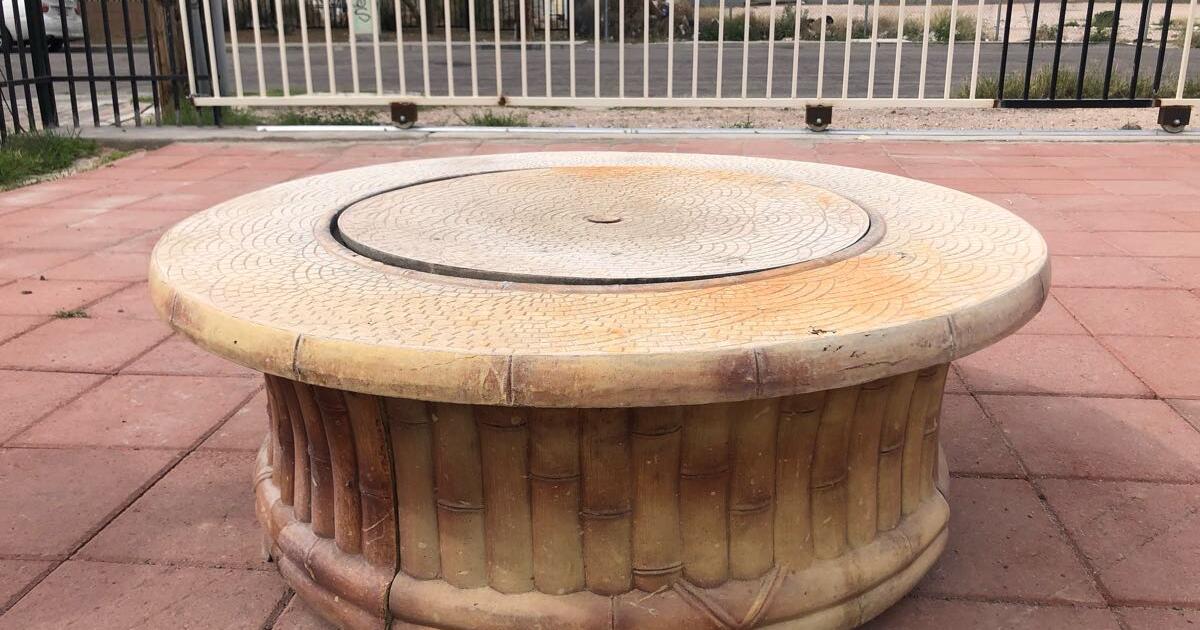 round outdoor fire pit metal top bamboo base 40” for $150 in Las Vegas ...