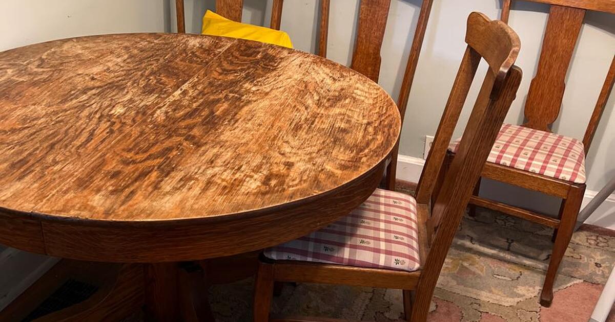 Wooden table. 4ft plus leafs for extension and four chairs wheeled legs ...