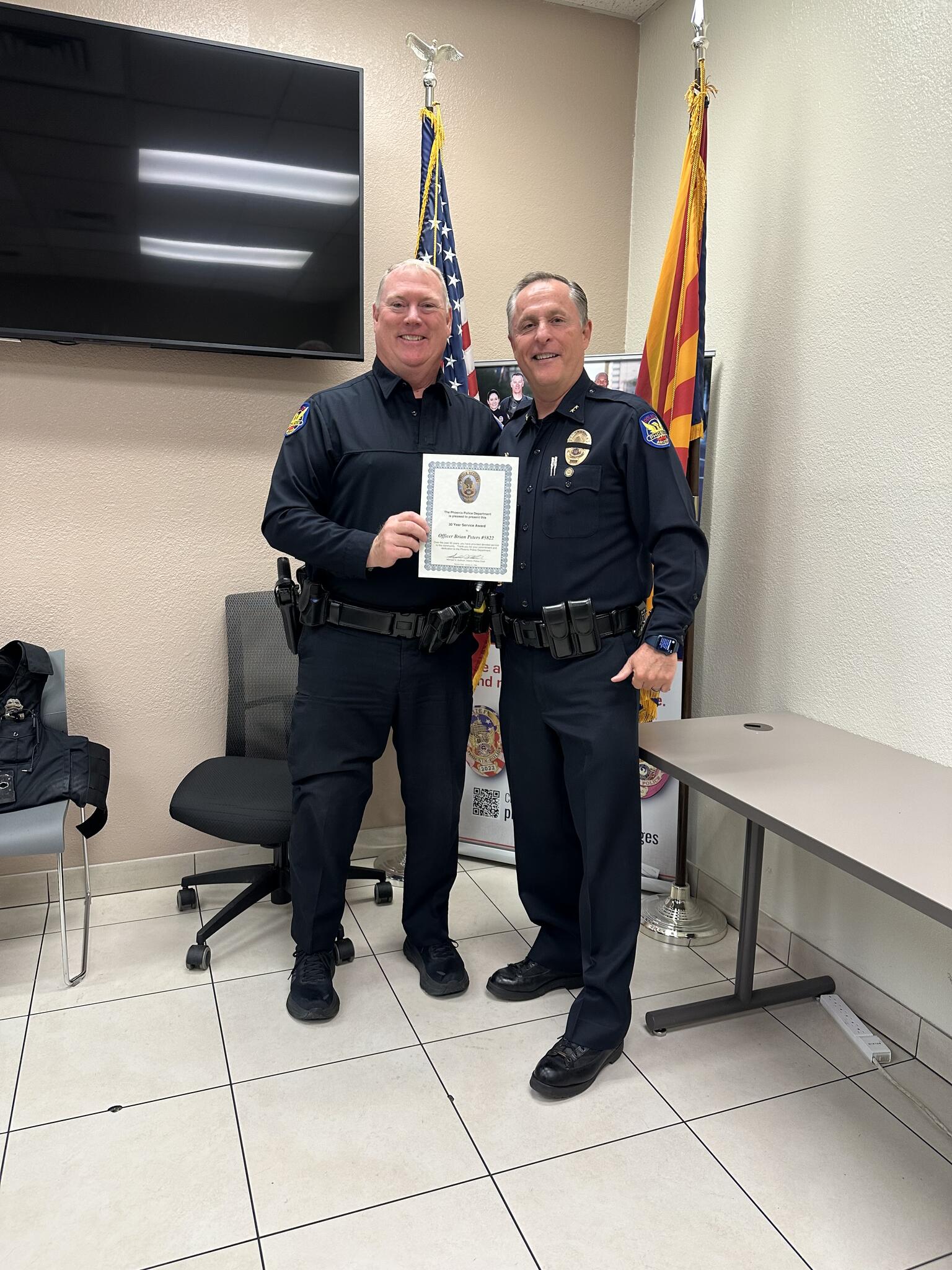 Congratulations to Officers Peters, he just hit 30 years of service ...