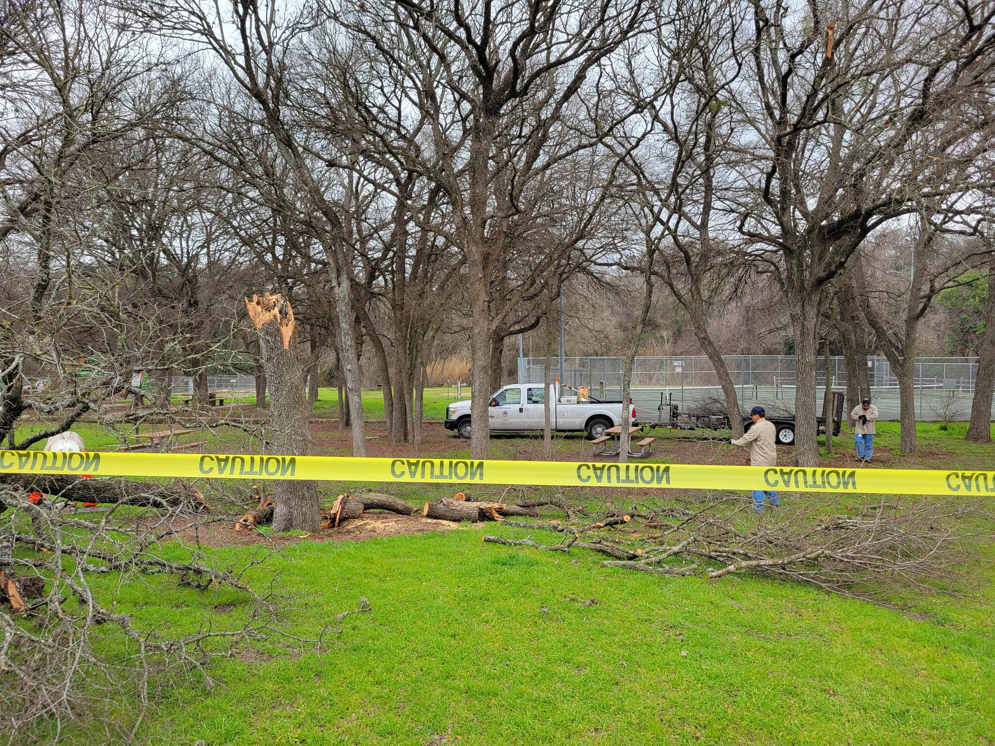 Park maintenance staff are working hard to clear debris from pathways ...