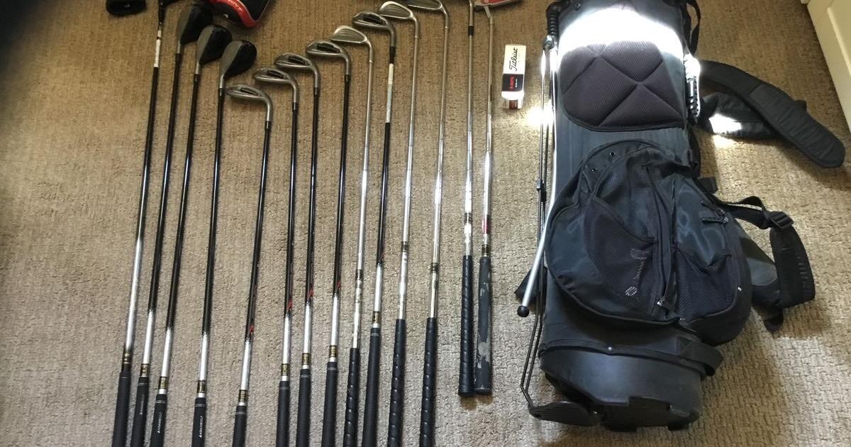 Full set of men’s right handed golf clubs. Mixed clubs, bag, tees ...