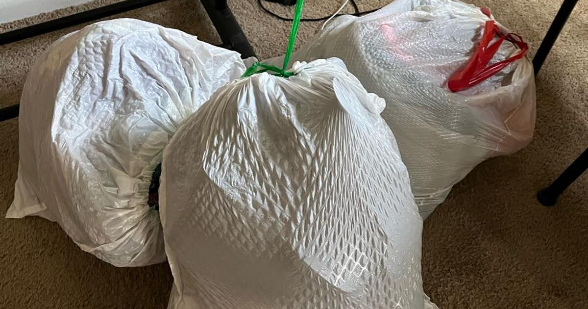 Two garbage bags, full of clothing, size 3X and 4X women’s, and a bag ...