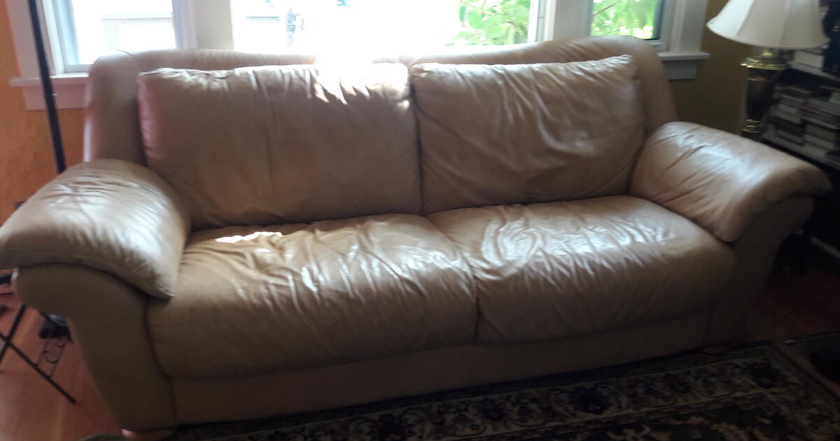 Italian leather sofa.Well cared for honey beige sofa. Attached back and ...