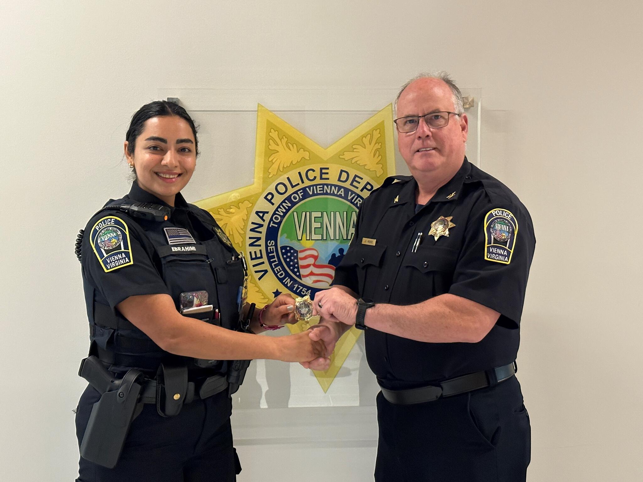 (Pictured above from left to right is Officer Sara Ebrahimi with Police ...