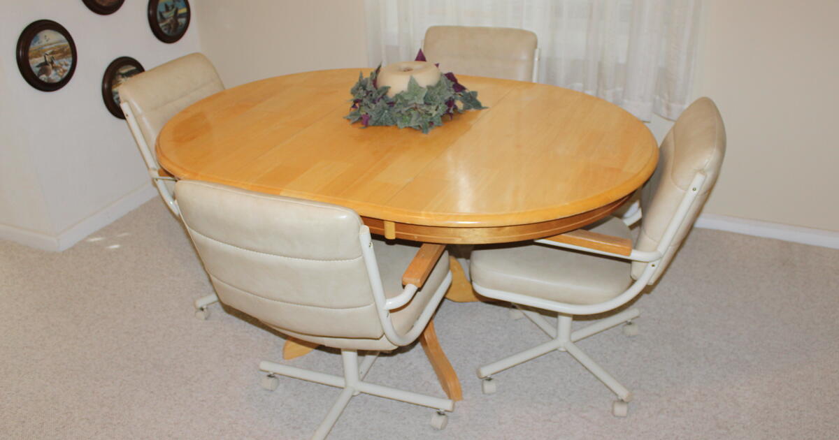 Moving and selling our oval, solid wood table and 6 swivel chairs with ...
